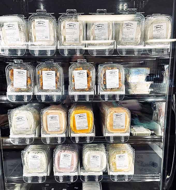 The refrigerated display case showcases vacuum-sealed treasures from Michigan waters, ready for enjoying at home.