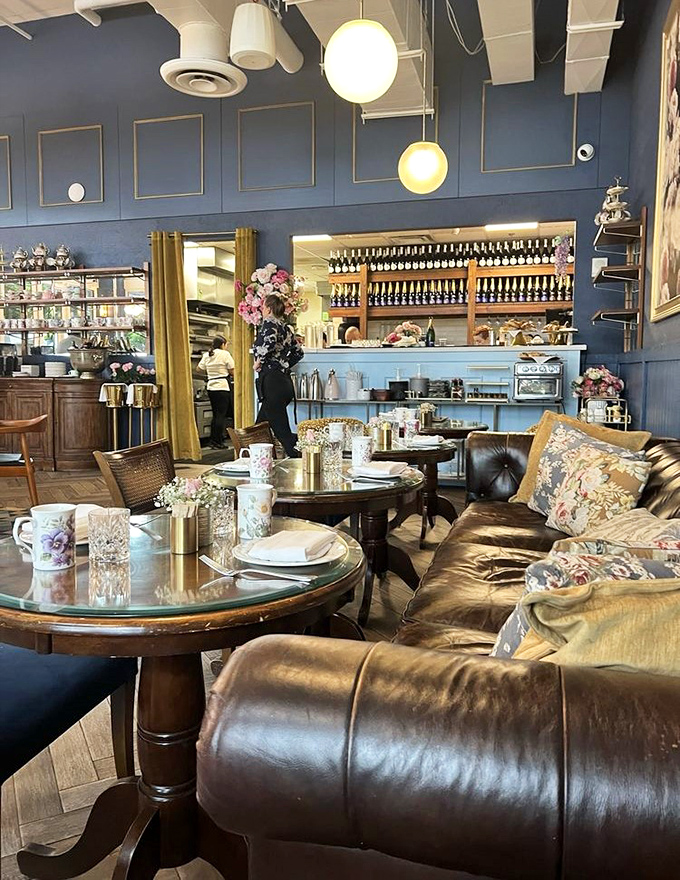 Leather sofas invite lingering conversations while golden accents catch the light. This isn't just a caf&eacute;&mdash;it's a living room for people with excellent taste.