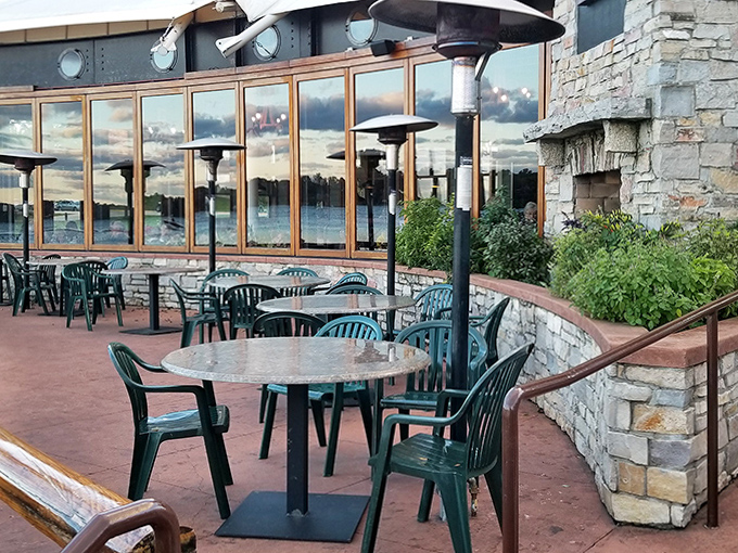 Stone walls frame tables where summer memories are made, with heat lamps standing ready to extend outdoor dining season against Michigan's wishes.