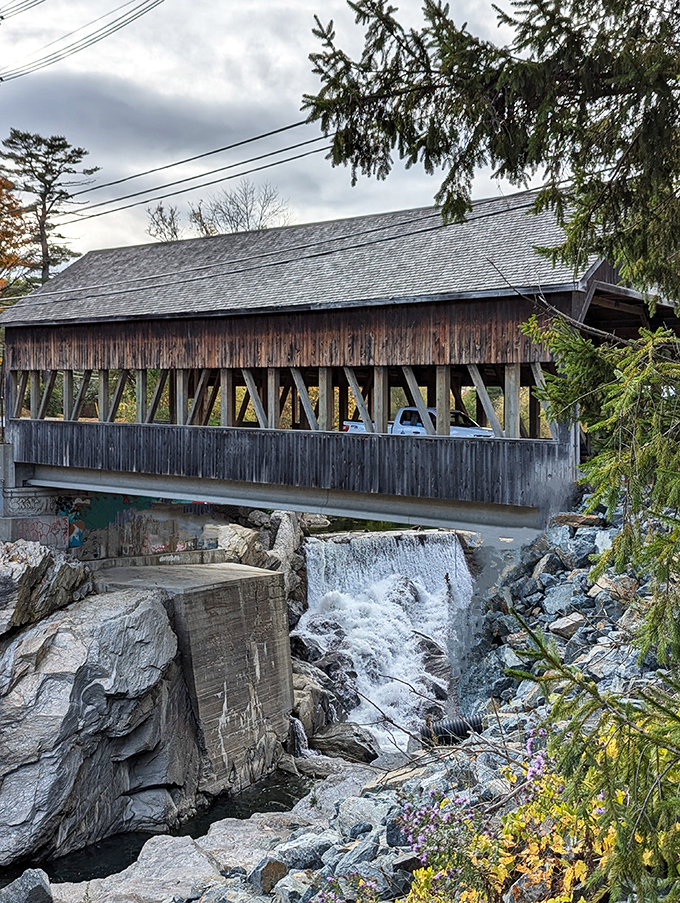 The bridge's weathered exterior speaks of Vermont winters endured and summer sun absorbed, a testament to enduring craftsmanship.