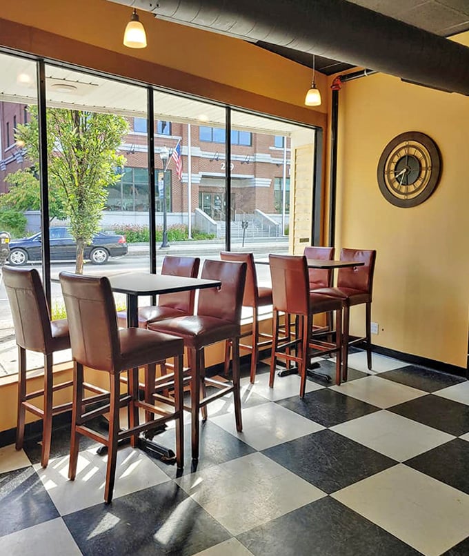 Sun-drenched window seating offers the perfect perch for people-watching while enjoying your favorite brew.