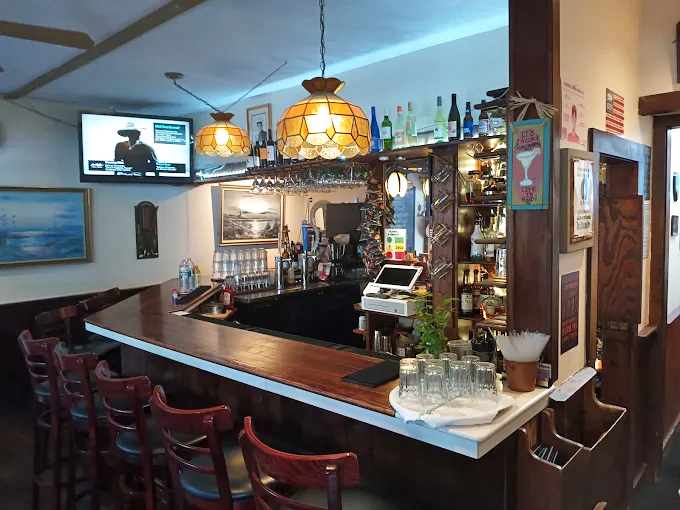 The bar area strikes that perfect balance between "Vermont cozy" and "actually functional," with warm lighting that makes everyone look like their best self.