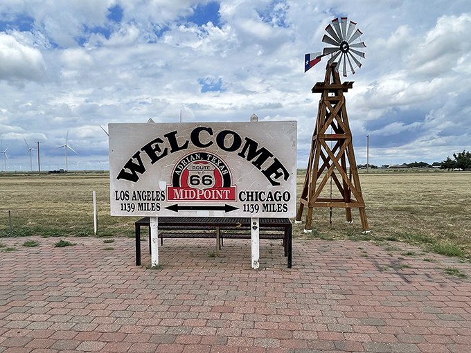 A simple sign marks the exact halfway point of Route 66, where road trippers are exactly 1,139 miles from both Chicago and Los Angeles.