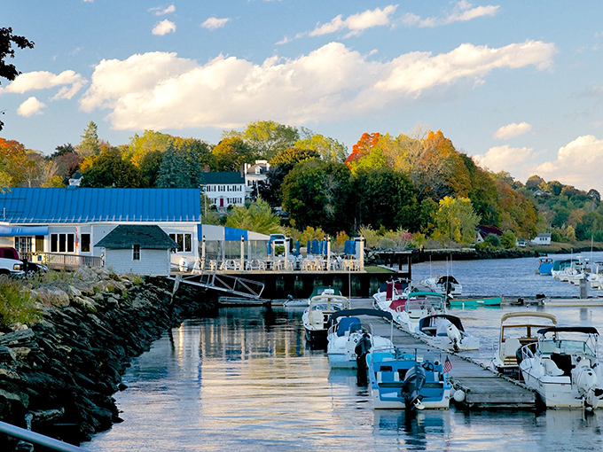 Bath's riverside location showcases the meeting of historic architecture and maritime activity, with boats dotting the harbor waters.