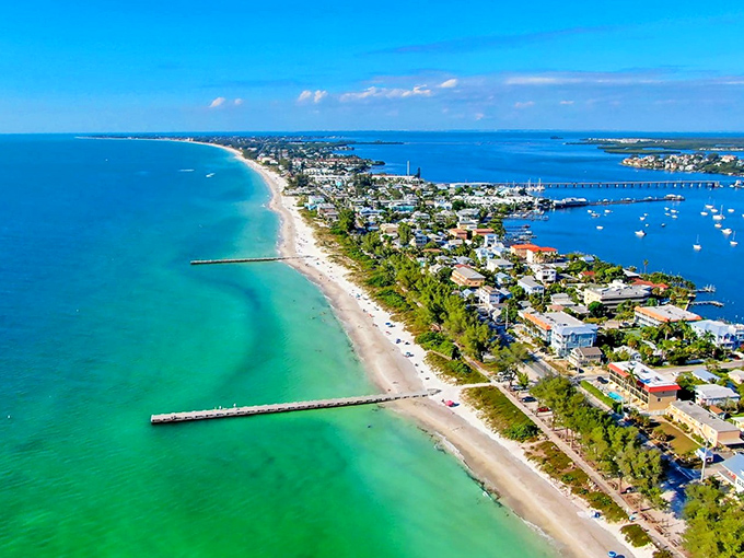 This aerial view showcases Anna Maria's narrow paradise&mdash;a sliver of land where two shades of blue water meet pastel cottages and streets narrow enough to navigate by bike.