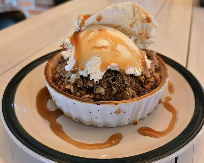 Dessert that demands attention &ndash; warm apple crisp topped with vanilla ice cream creates the perfect hot-cold contrast that makes spoons move faster than firefighters to an alarm.