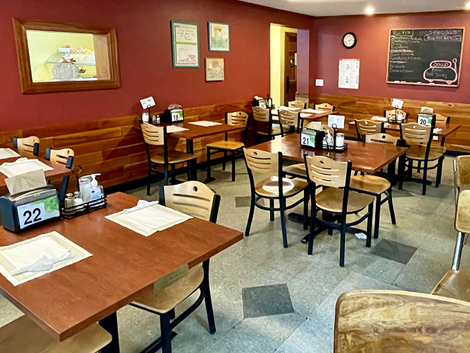 Empty tables waiting for the next rush &ndash; each numbered spot ready to become someone's favorite booth for a memorable meal.