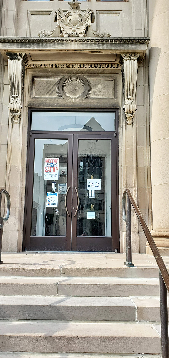 Glass doors offer a glimpse into the literary wonderland within, while preserving the building's historical integrity and architectural significance.