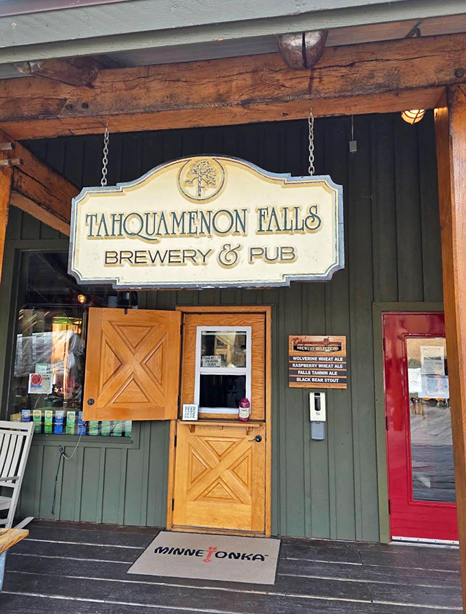 The welcoming entrance sign swings gently above wooden doors &ndash; promising wilderness-inspired food and drink just steps from natural wonders.