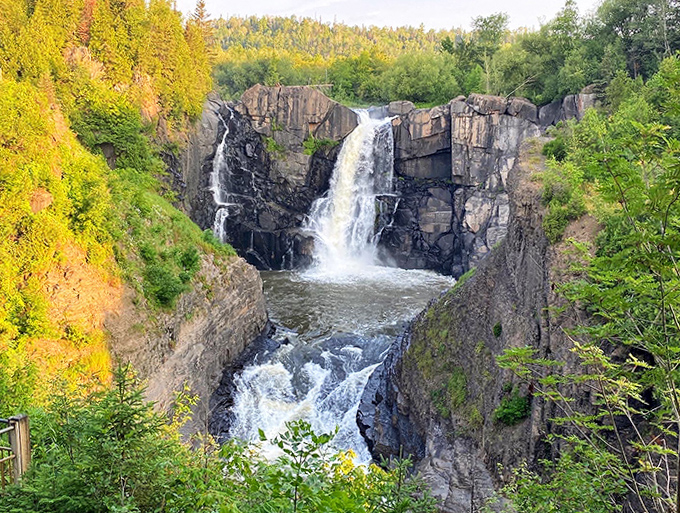 High Falls shows off its full majesty here, framed by forest greenery that seems to applaud its performance.