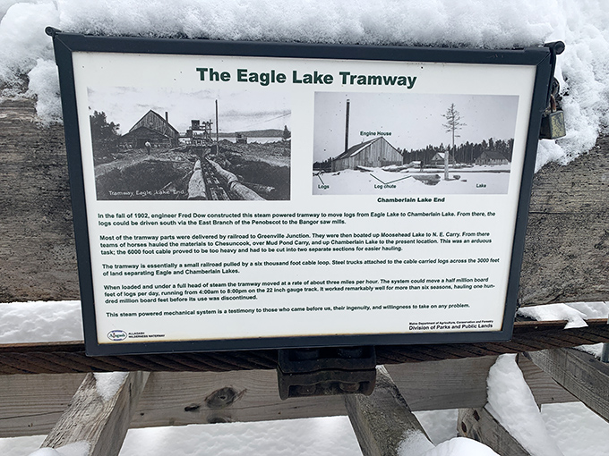 The informational sign stands as a lone storyteller, preserving the Eagle Lake Tramway's remarkable engineering legacy for curious visitors.