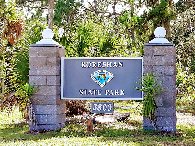 The park entrance sign stands as a portal between modern Florida and a fascinating chapter of American utopian history.