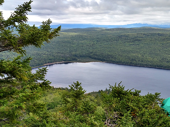The reward for climbing Nesuntabunt: A bird's-eye view of Nahmakanta nestled among endless green mountains.
