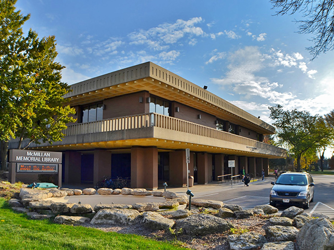 The McMillan Memorial Library serves as both knowledge keeper and community gathering place, its mid-century design housing modern connections.