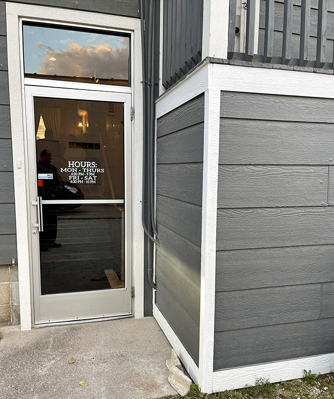 Opening Hours: The modest entrance and straightforward hours posted on the door reflect Fricano's philosophy: focus on doing one thing exceptionally well, without unnecessary complications.