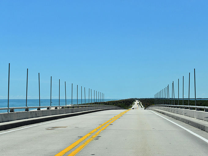 The Overseas Highway section shows A1A at its most dramatic, suspended between ocean and sky like a concrete tightrope.