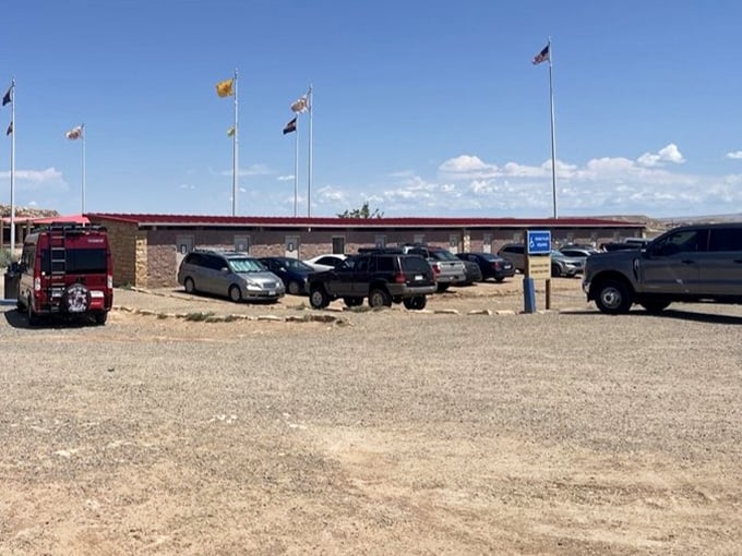 The monument's parking area fills with license plates from across America, each representing a journey to this special spot.