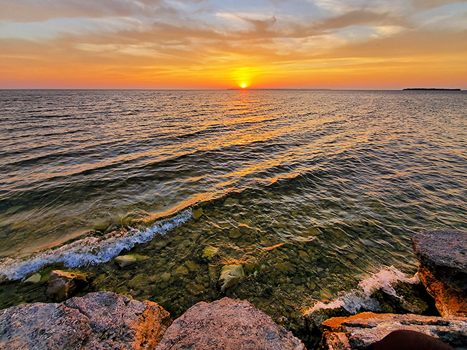 Nature's masterpiece unfolds where water meets woodland—Door County's shoreline views never fail to inspire awe.