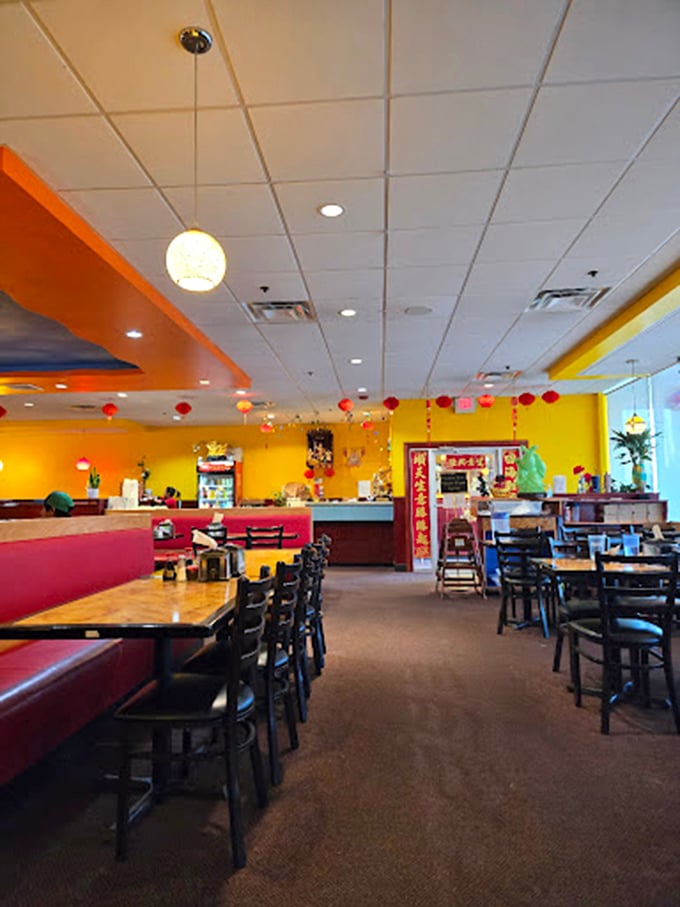 Red booths and colorful d&eacute;cor create an atmosphere that's simultaneously energetic and comfortable for lingering over multiple plate refills.