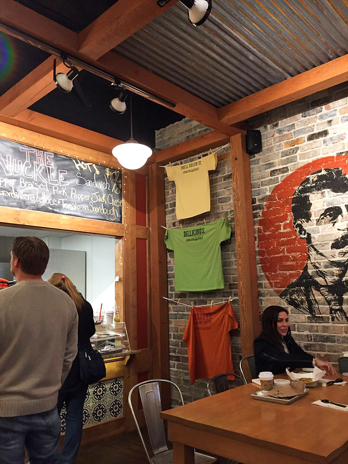 Colorful t-shirts displayed on the wall have become coveted souvenirs for visitors wanting to proclaim their pickle allegiance.