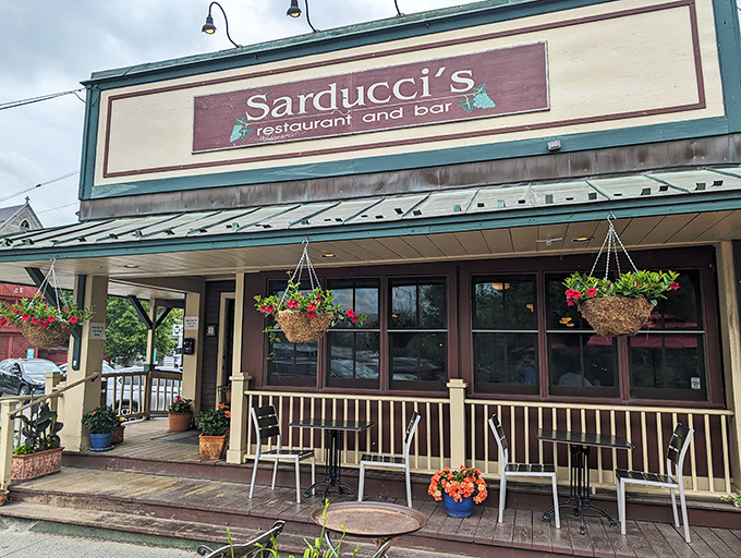 Sarducci&rsquo;s welcoming storefront invites diners inside, promising comforting Italian favorites in a cozy riverside setting.
