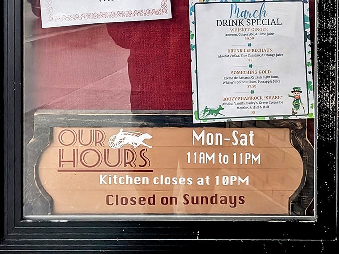 Operating hours posted on the door remind us that even culinary institutions need a day of rest, closed Sundays for well-deserved recovery.