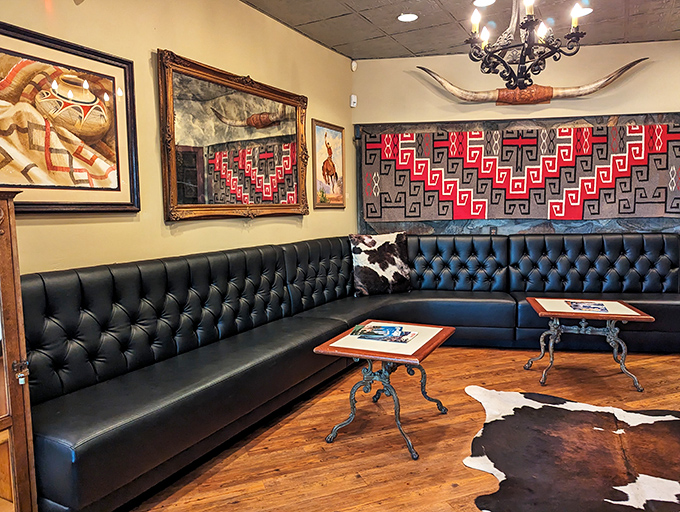 The waiting area's leather banquette and Southwestern art create the perfect prelude to your dining experience, comfort with a dash of cowboy.