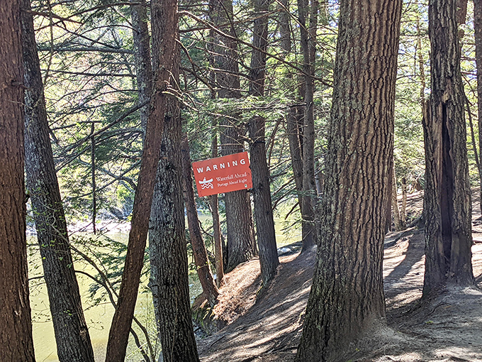 Warning signs remind visitors to respect nature's power while enjoying its beauty from a safe distance.