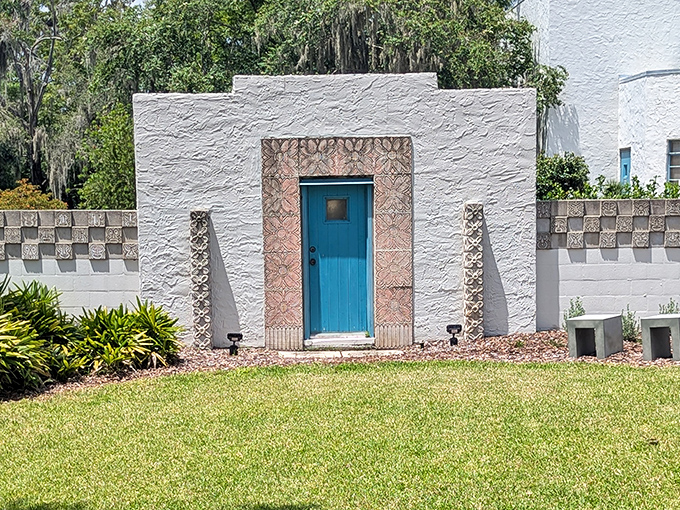 This striking turquoise door pops against white stucco walls &ndash; Florida's architectural answer to finding paradise behind door number one.