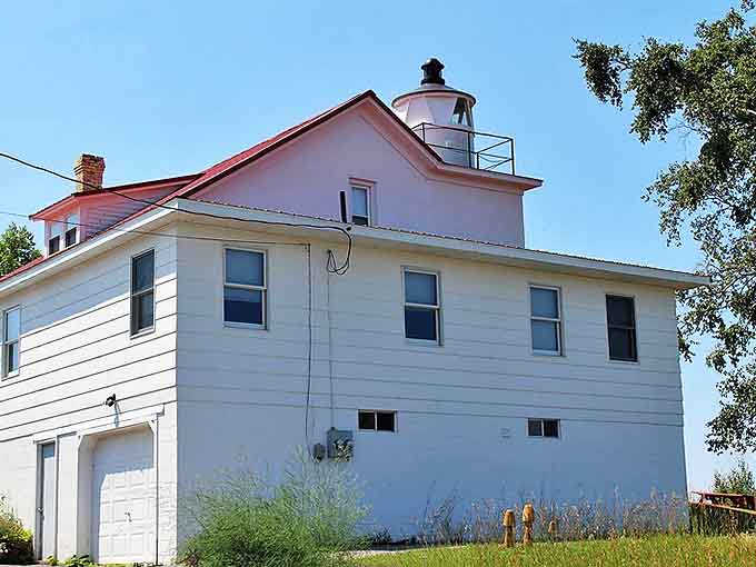 The lighthouse's rear view reveals thoughtful modern additions that complement the historic structure while maximizing those spectacular Lake Superior vistas.