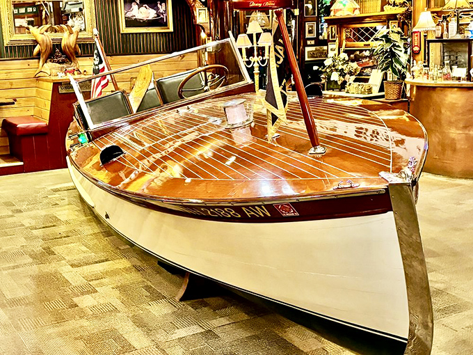The gleaming wooden boat serves as both centerpiece and conversation starter &ndash; how many restaurants can claim to have a vintage Chris-Craft as part of their d&eacute;cor?