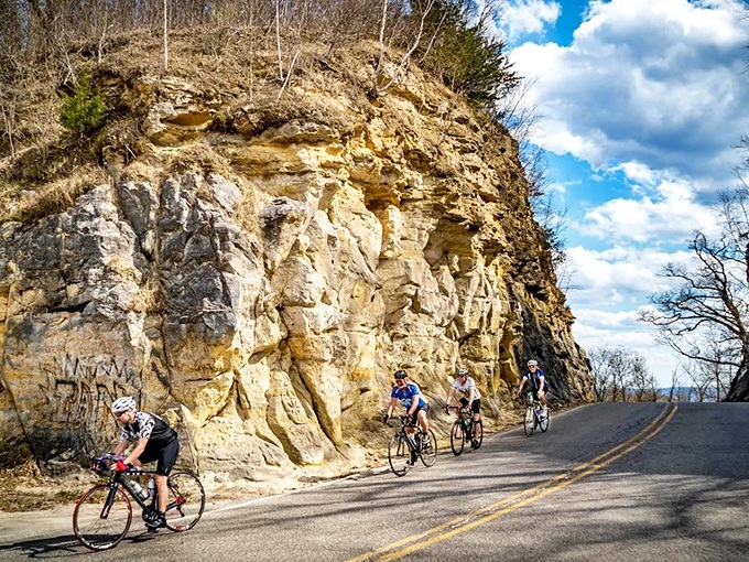 Cyclists tackle the approach to Mindoro Cut, their modern challenge a mere shadow of the original construction effort.