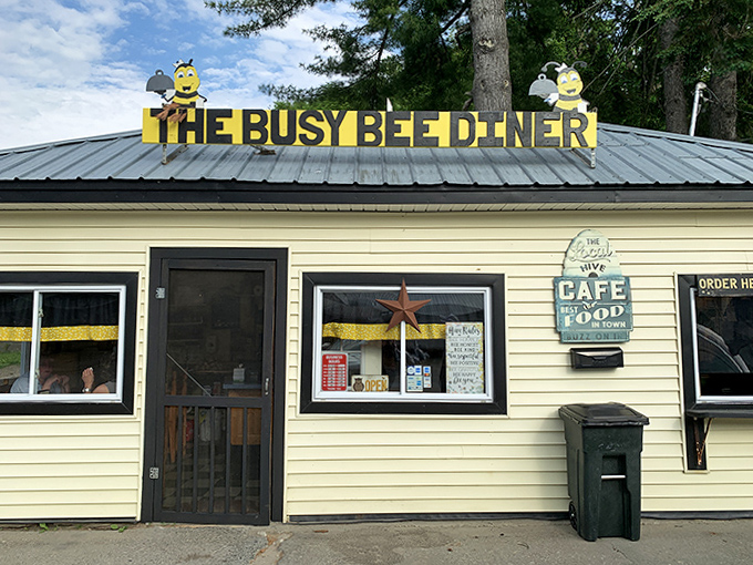 The iconic rooftop sign with cartoon bees welcomes hungry travelers &ndash; a beacon of breakfast hope on Vermont's winding roads.