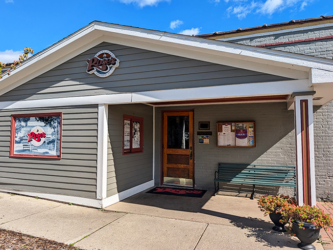 An unassuming doorway that serves as a portal between ordinary life and the extraordinary dining experience waiting just inside.