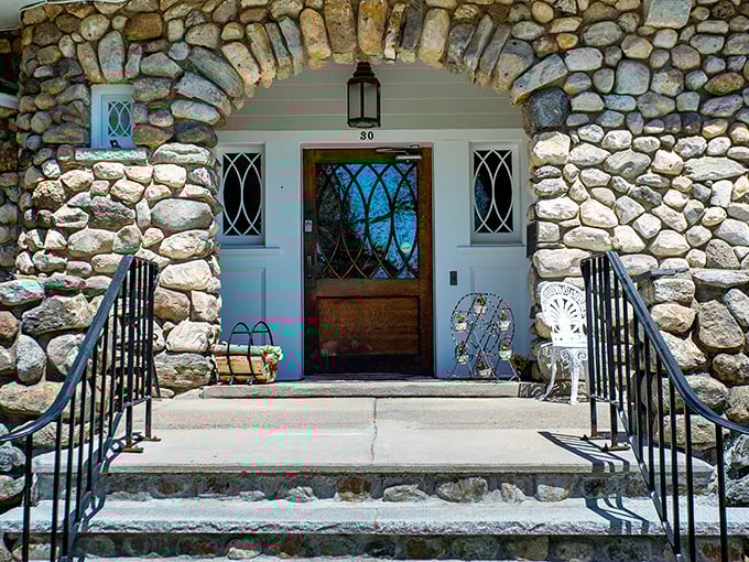 The stone archway entrance welcomes visitors with a blend of rustic charm and architectural elegance.