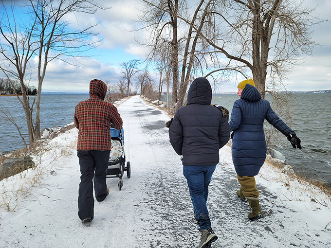 Winter warriors find solitude on the snow-covered causeway, where every footstep writes a temporary story on the blank page of snow.
