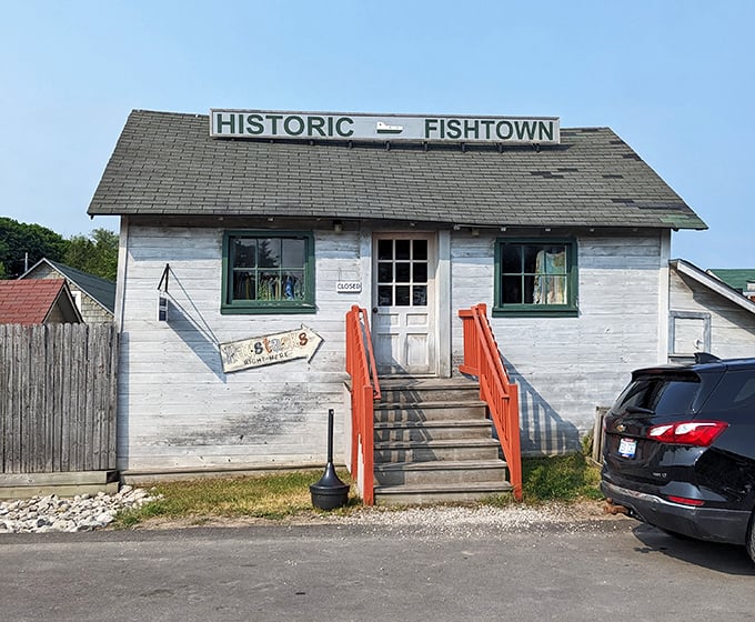 This weathered shanty has seen more Michigan seasons than most of us ever will – its faded wood a testament to resilience.