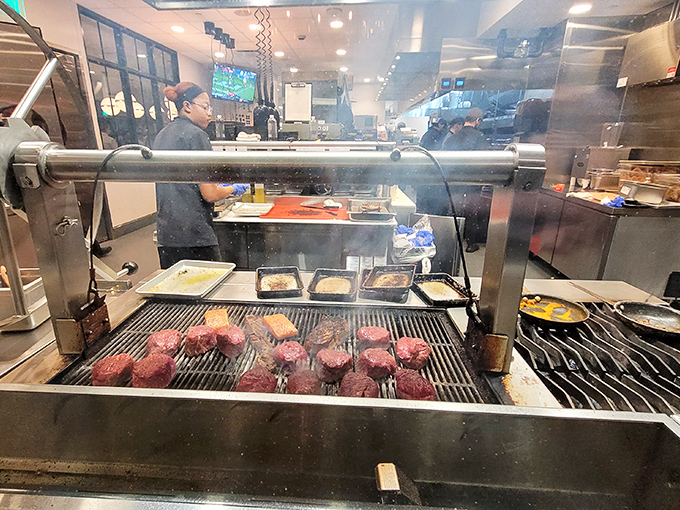 Behind the scenes, culinary magic happens on the grill, where prime cuts transform under watchful eyes and dancing flames.