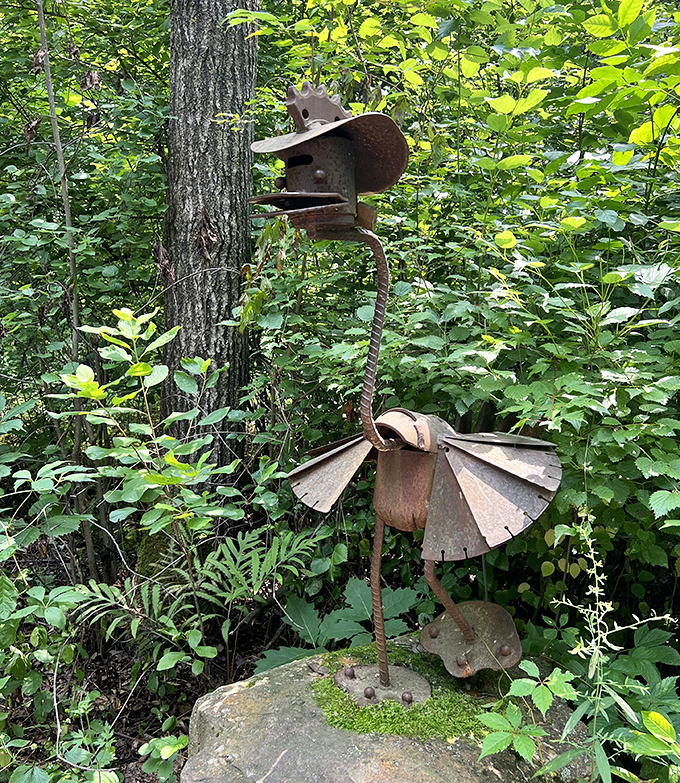 Elegant simplicity defines this wooden seed-pod sculpture, its smooth curves capturing light differently throughout the day's changing moods.