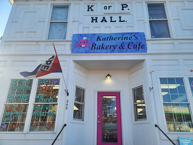 Katherine's welcoming fa&ccedil;ade features inspirational window art and a pink door that practically whispers, "Calories don't count when you're having fun."