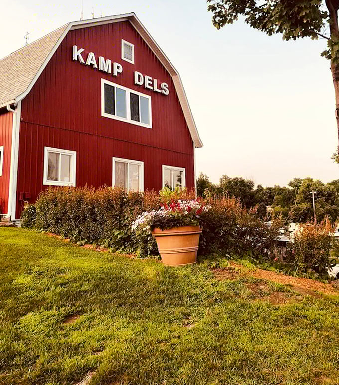 The classic red barn structure houses memories and adventures, surrounded by carefully tended gardens that welcome visitors.