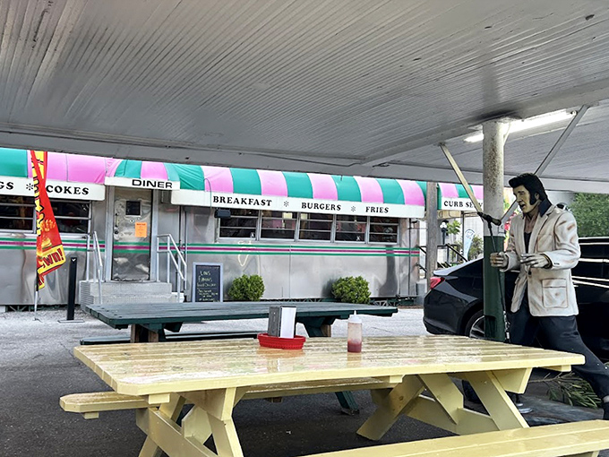 Simple picnic tables under Florida skies offer the perfect setting for enjoying classic diner fare without walls.