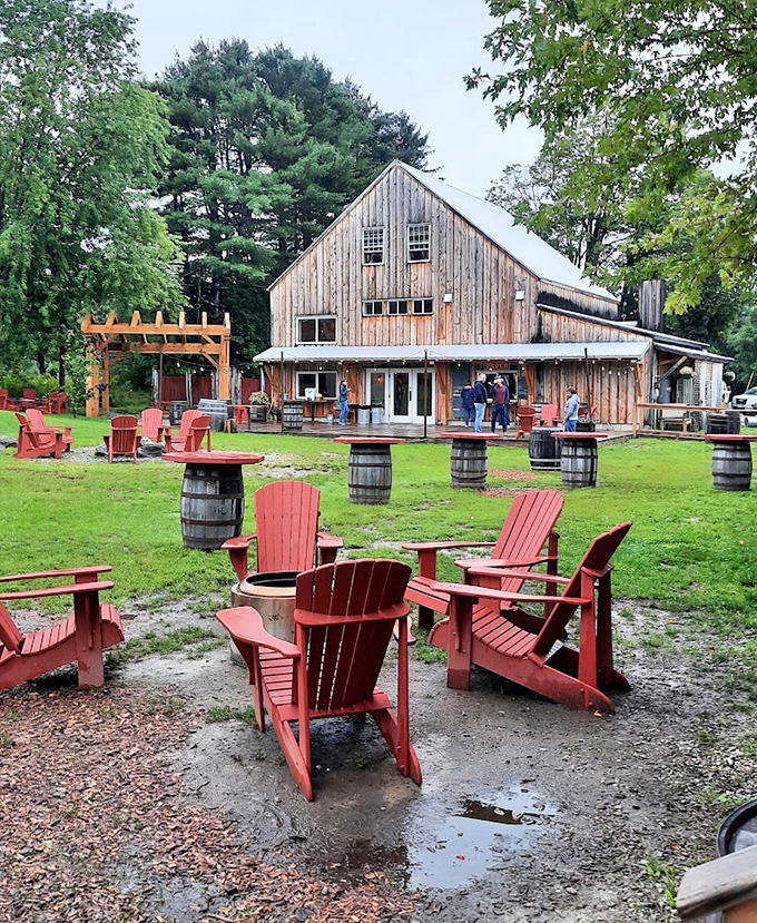 Rain or shine, the outdoor seating area invites lingering &ndash; red Adirondack chairs and barrel tables create casual gathering spots for friends old and new.