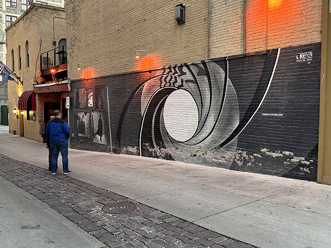 The exterior wall features spy-themed artwork that gives observant passersby their first clue about what lies within.