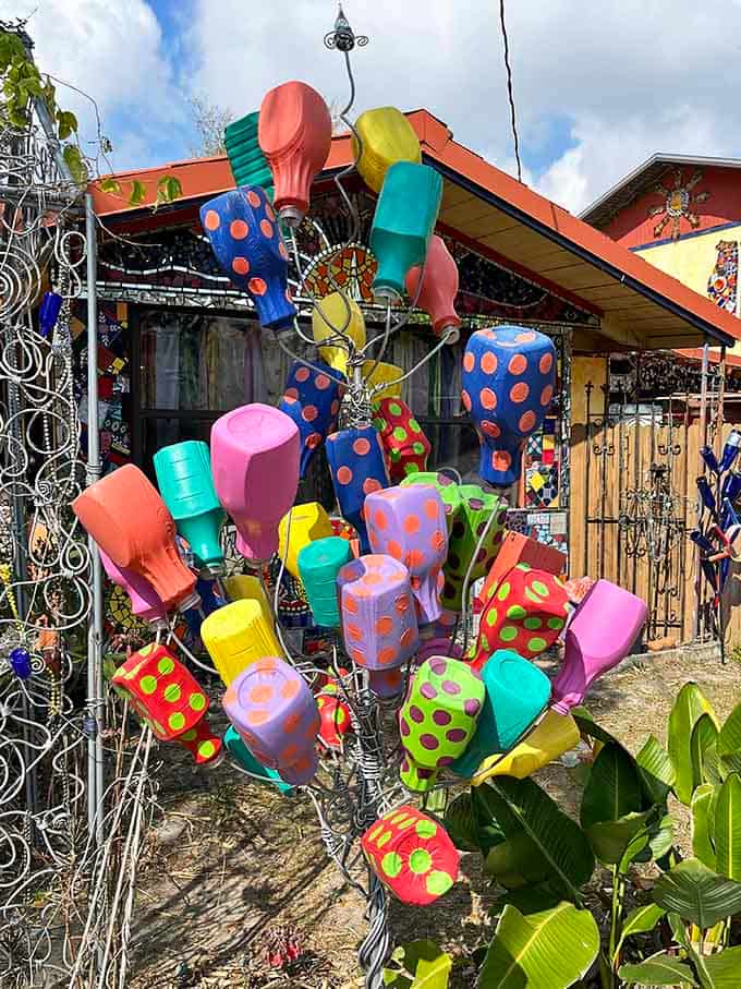 Painted plastic bottles become a towering sculpture, proving that trash and treasure are really just a matter of perspective.