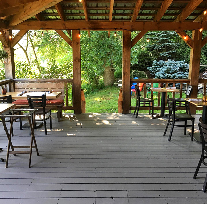 Dappled sunlight through timber frames creates the perfect outdoor dining space for those perfect Vermont summer evenings.
