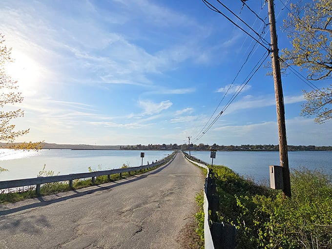 The causeway stretches like a promise across the water, connecting mainland life to island tranquility.