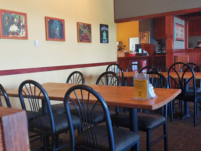 Comfortable seating and thoughtful decor create distinct dining areas while maintaining the cozy, welcoming atmosphere throughout the restaurant.