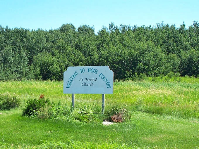 "Welcome to God's Country" proclaims this weathered sign, capturing the reverence locals feel for this challenging yet beautiful corner of Minnesota.