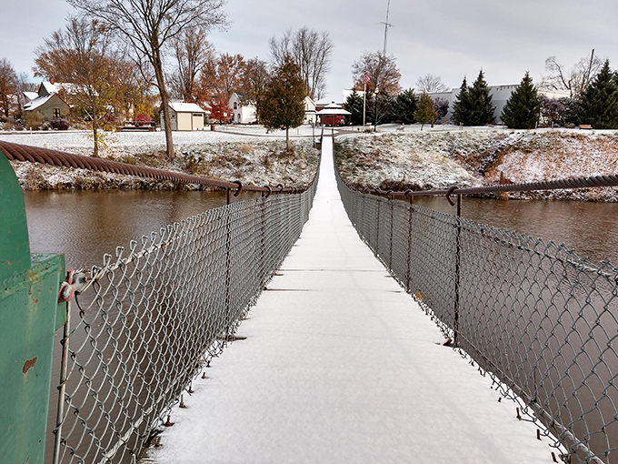 Winter adds another dimension to the crossing experience, with snow-dusted planks creating a serene yet slightly more adventurous journey.